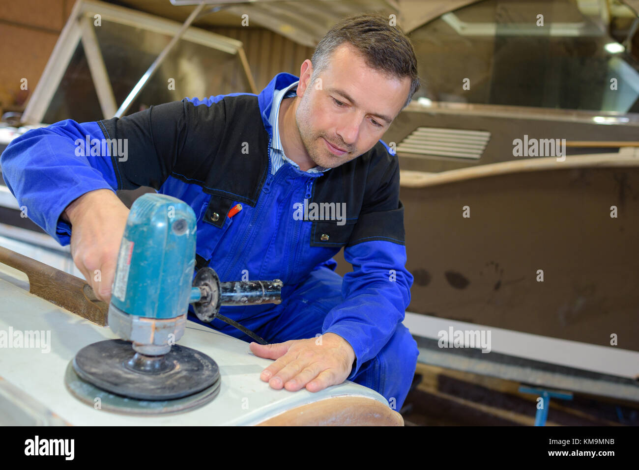 worker polishing a frame Stock Photo - Alamy