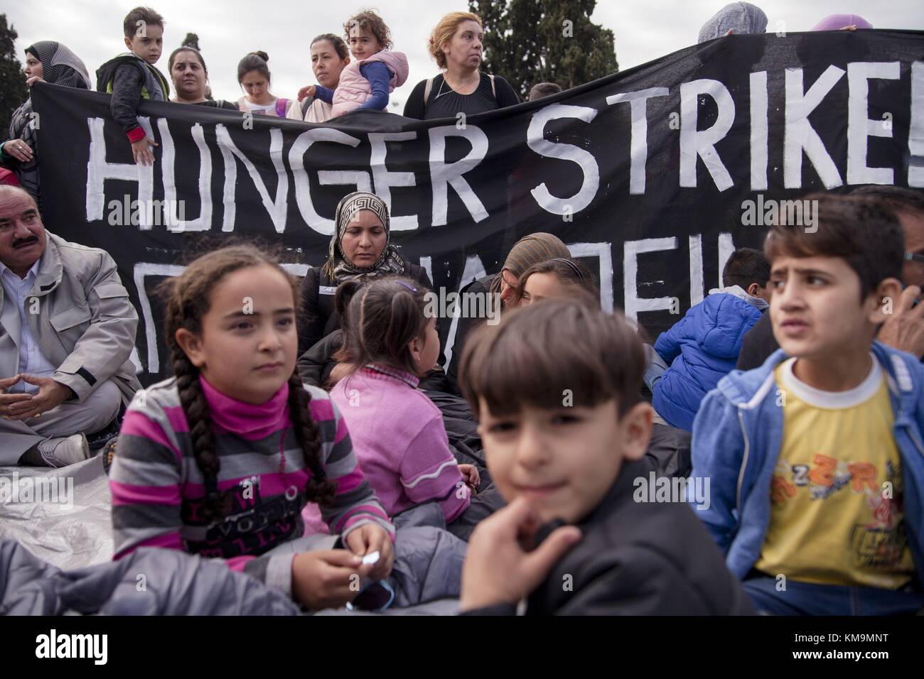 Syrian refugees and their children, banner "Hunger Strike", during ...