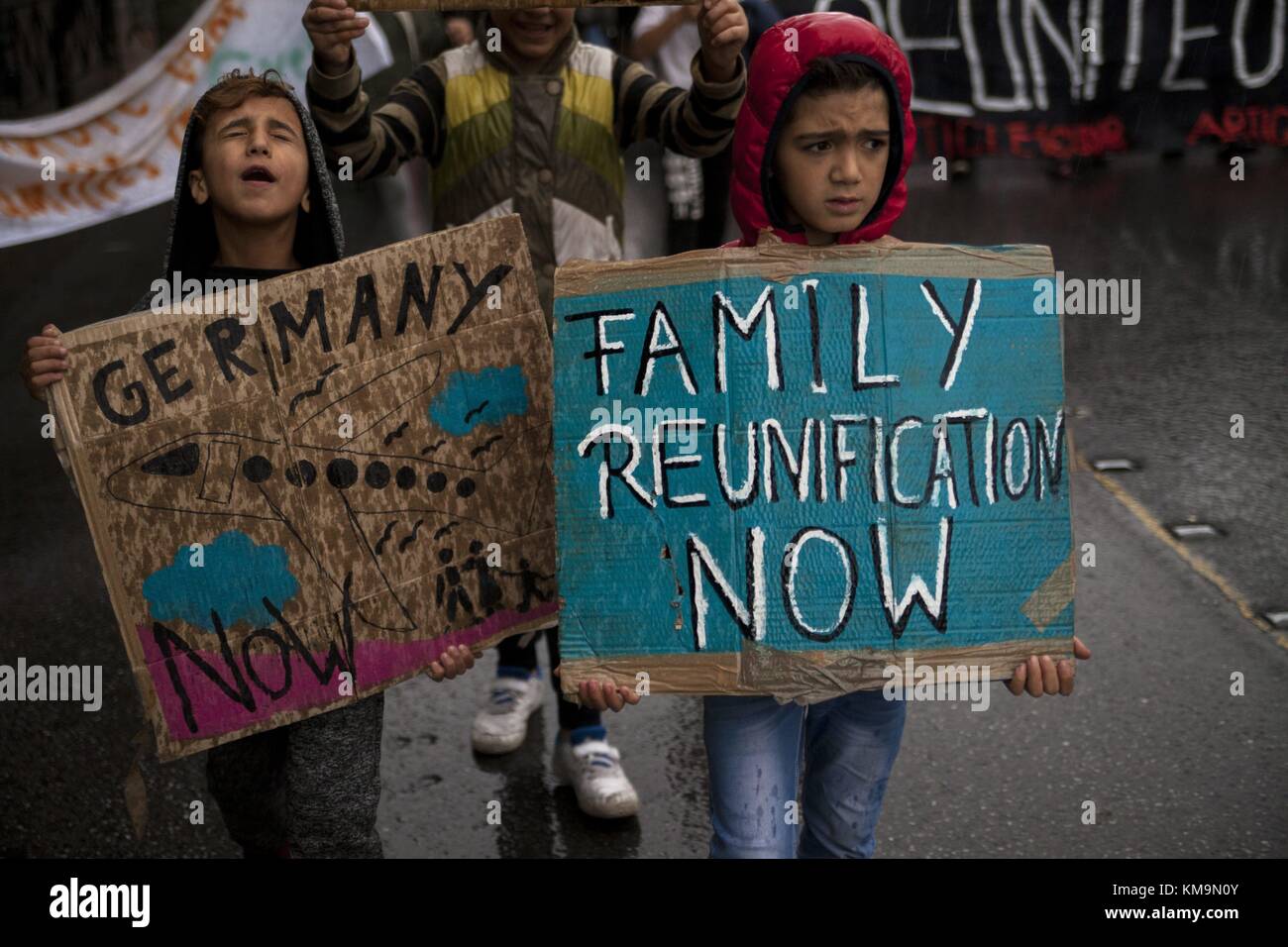 Syrian Refugee Children with signs "Germany now. Family Reunification ...