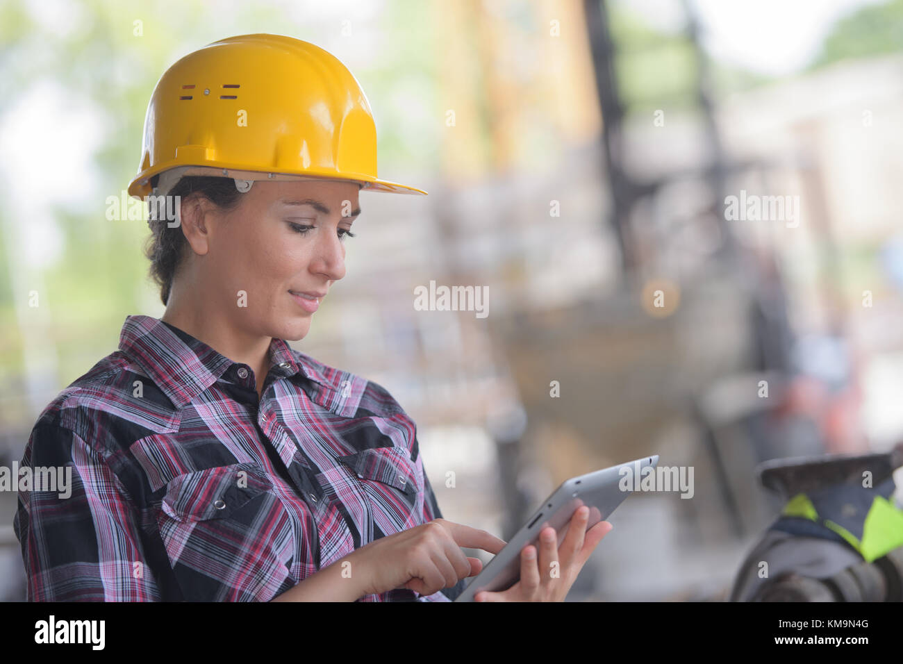 female construction engineer working on tablet at site Stock Photo - Alamy