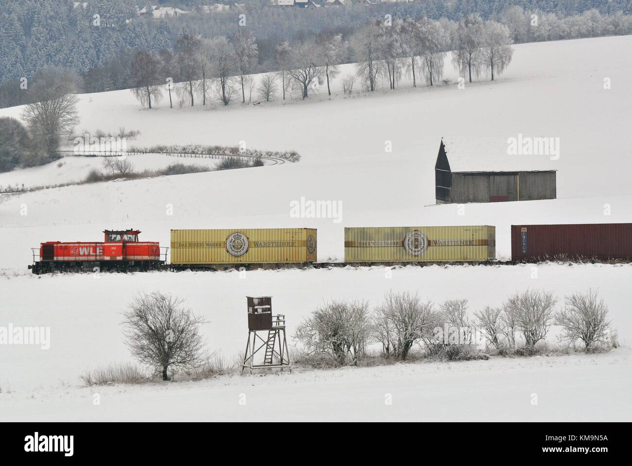 Freight train with beer container from the Warsteiner brewery in snow ...