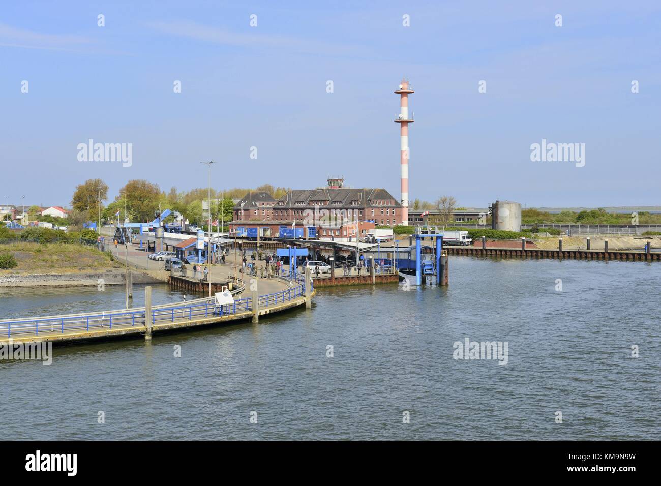 Borkum's ferry terminal with a small harbour basin and buildings around ...
