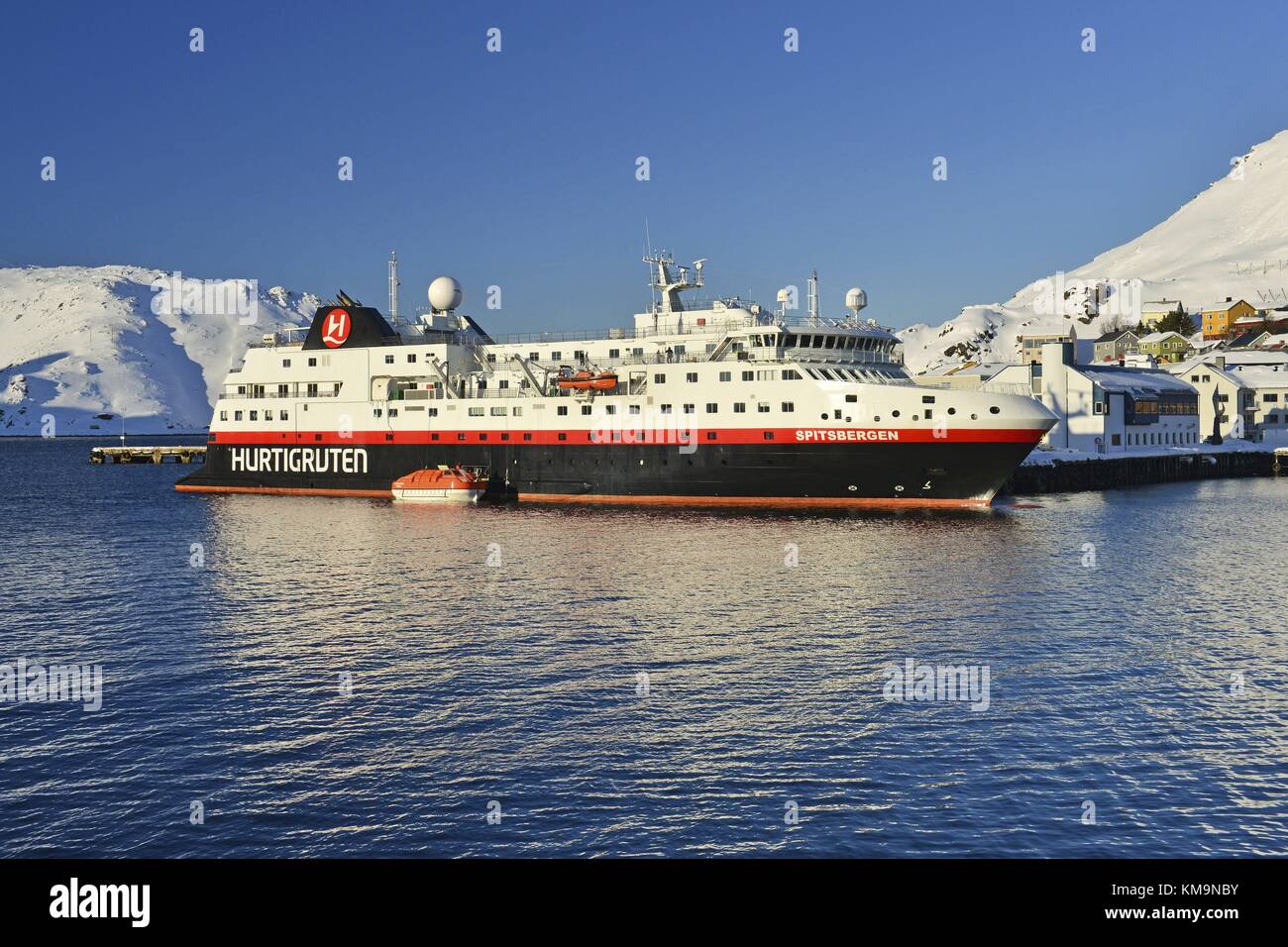 Small orange lifeboat beside the Hurtigruten ship MS Spitsbergen in ...