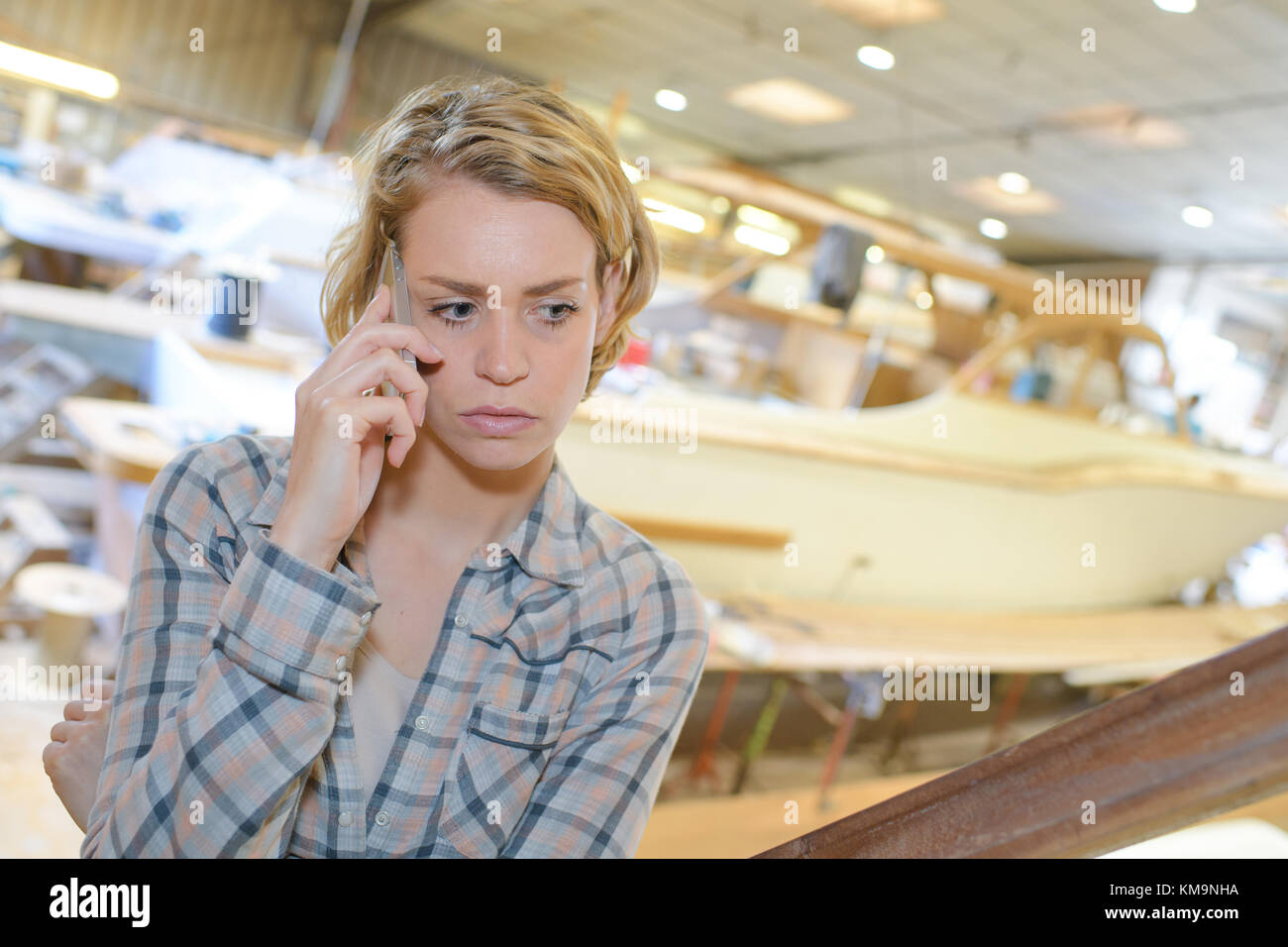 female supervisor with surprise looks at a warehouse worke Stock Photo ...