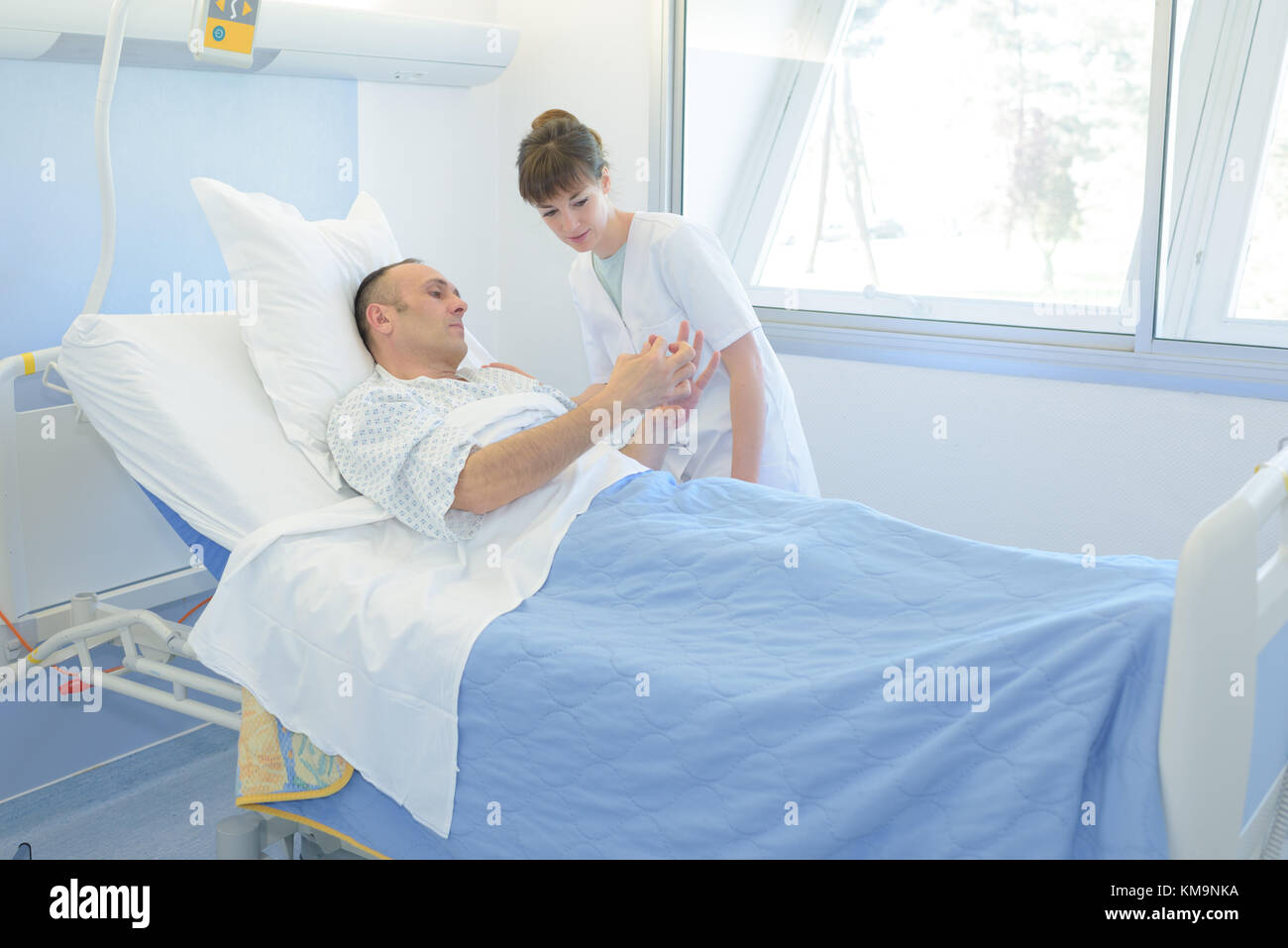 nurse listening to patients request at the hospital Stock Photo - Alamy