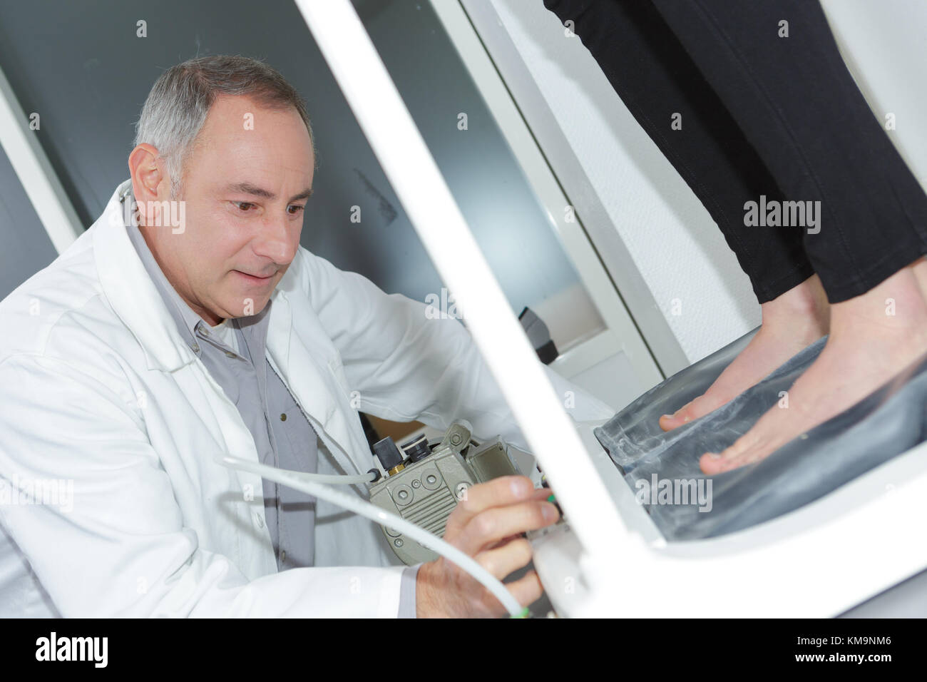 podiatrist working with foot Stock Photo - Alamy