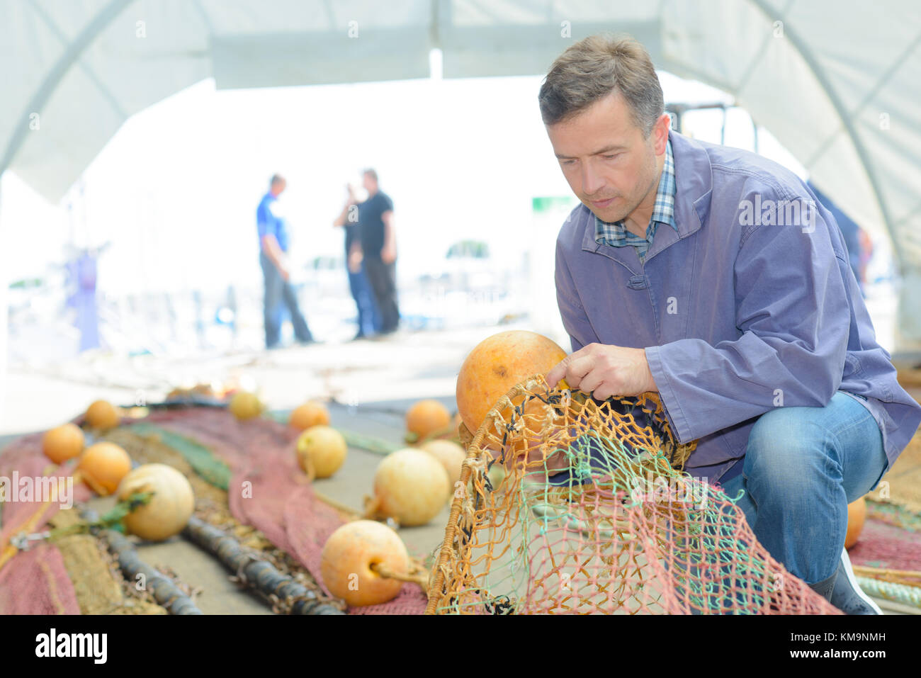 preparing the fishing net Stock Photo - Alamy