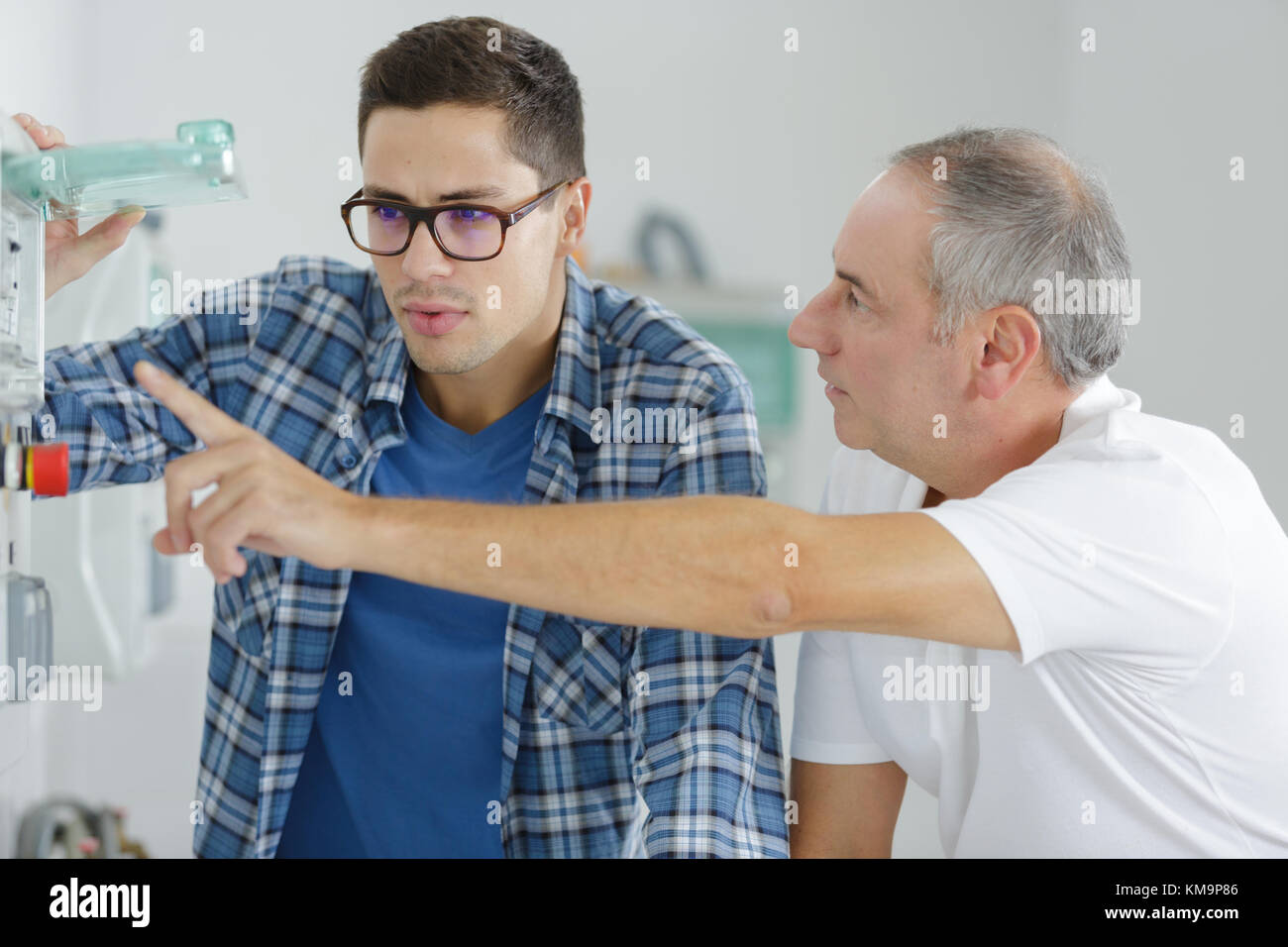 Man asking colleague a question Stock Photo - Alamy