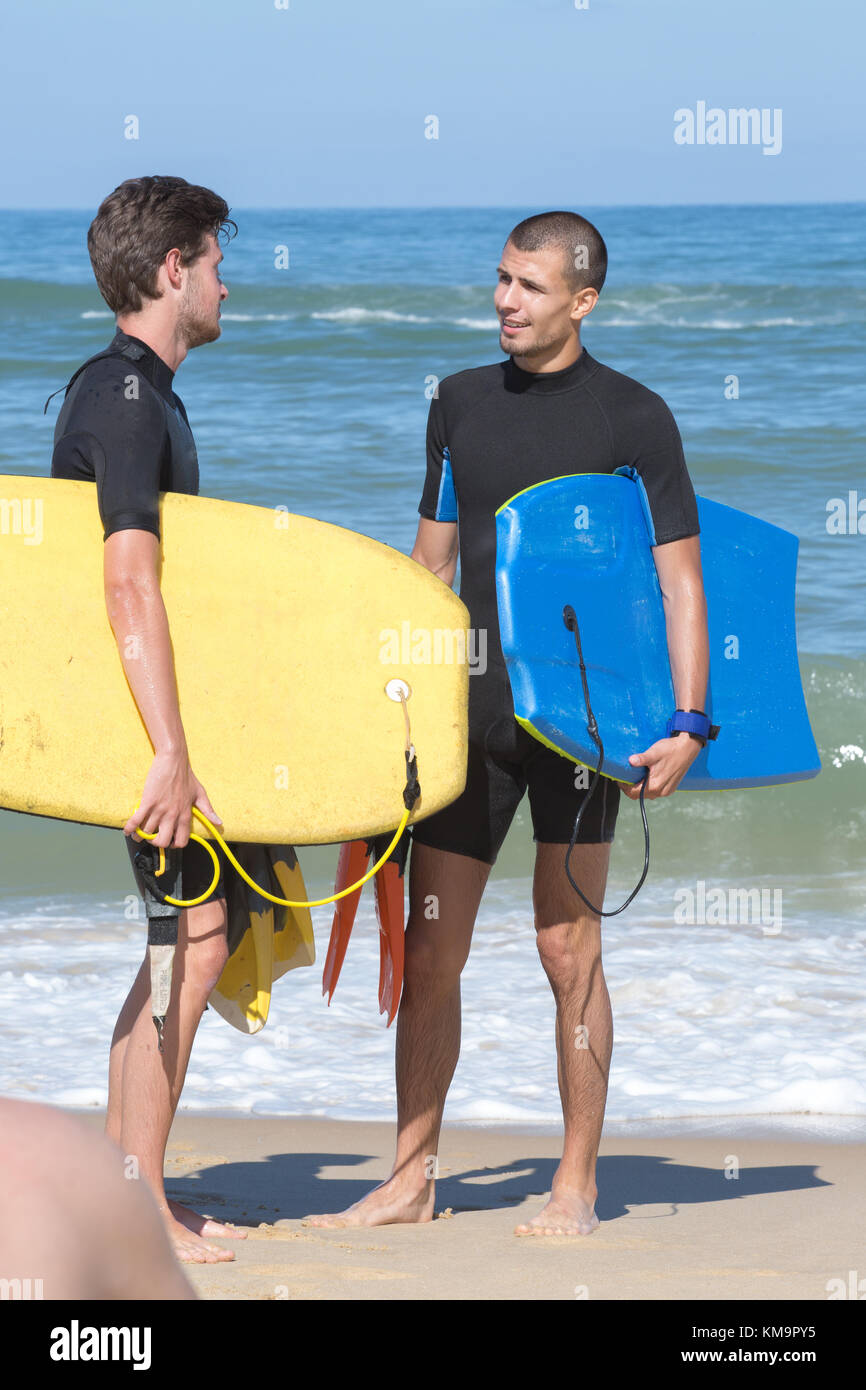 body boarder surfers on beach Stock Photo - Alamy