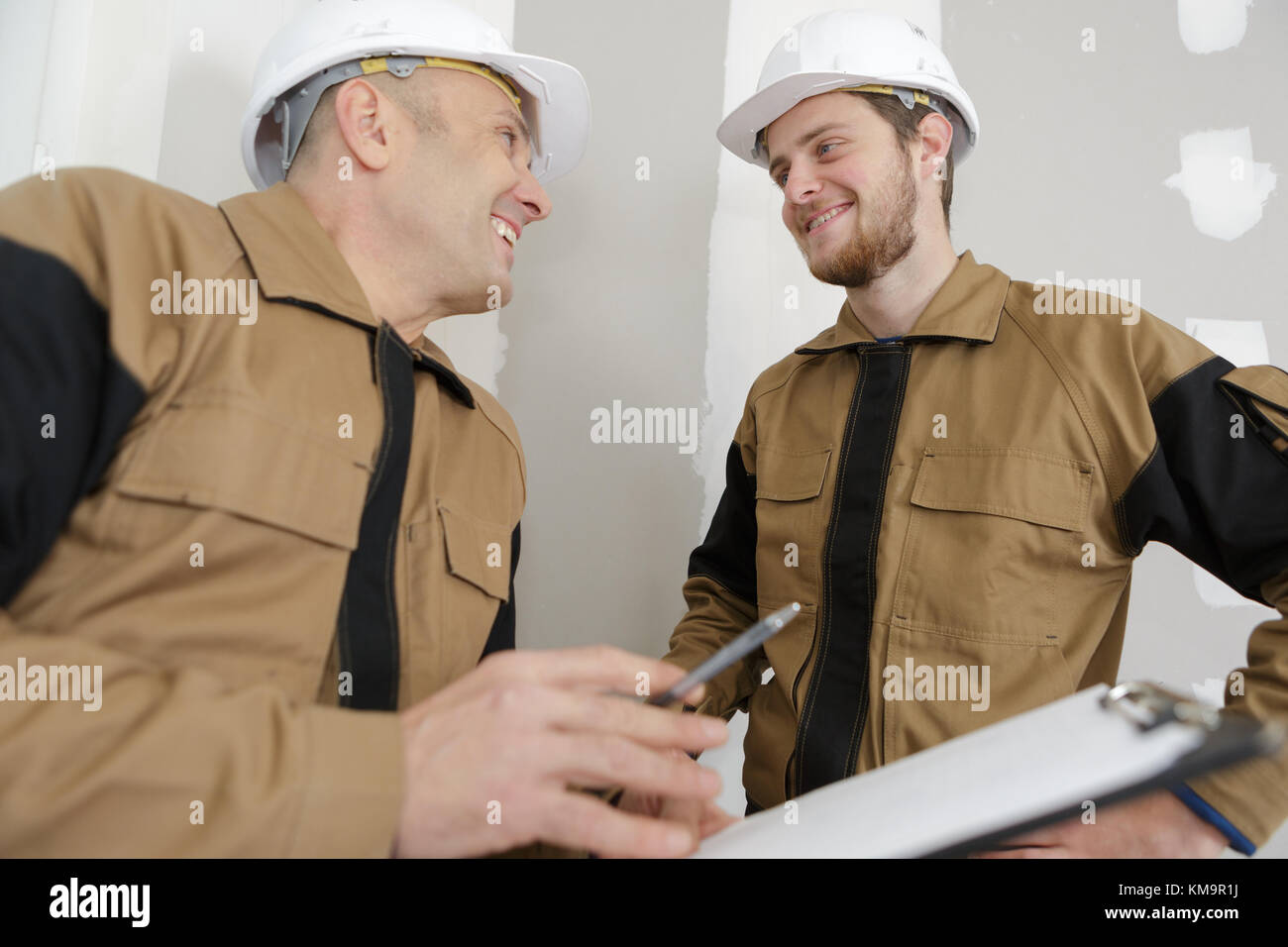 construction workers laughing together Stock Photo - Alamy