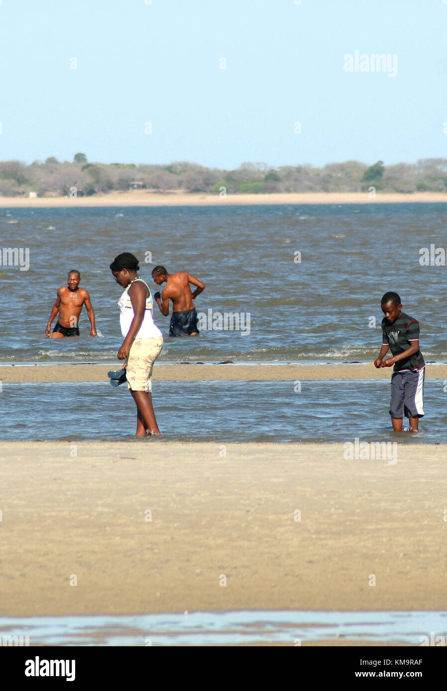 Maputo, Mozambique, people standing and swimming on the beach Stock ...