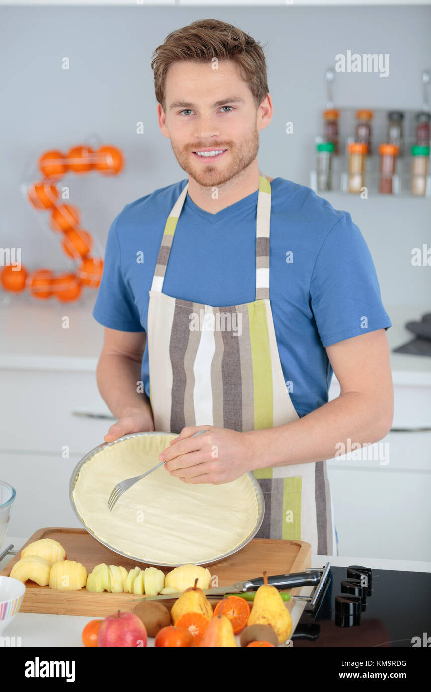 young man making a apple pie Stock Photo - Alamy
