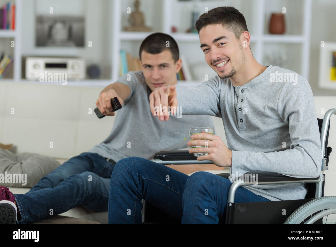 friend changing the television channel Stock Photo - Alamy