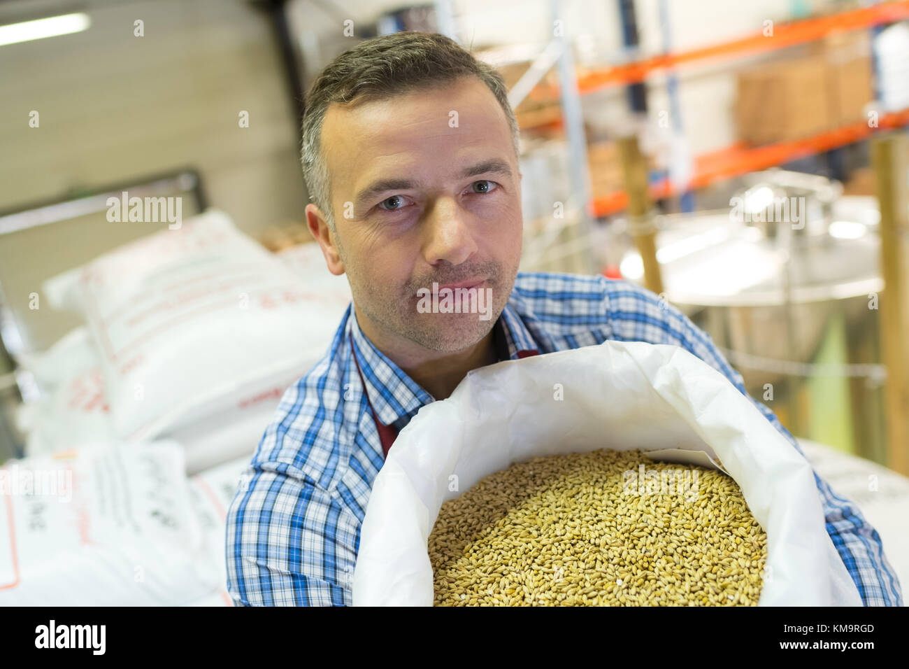 man showing rice seed product Stock Photo - Alamy