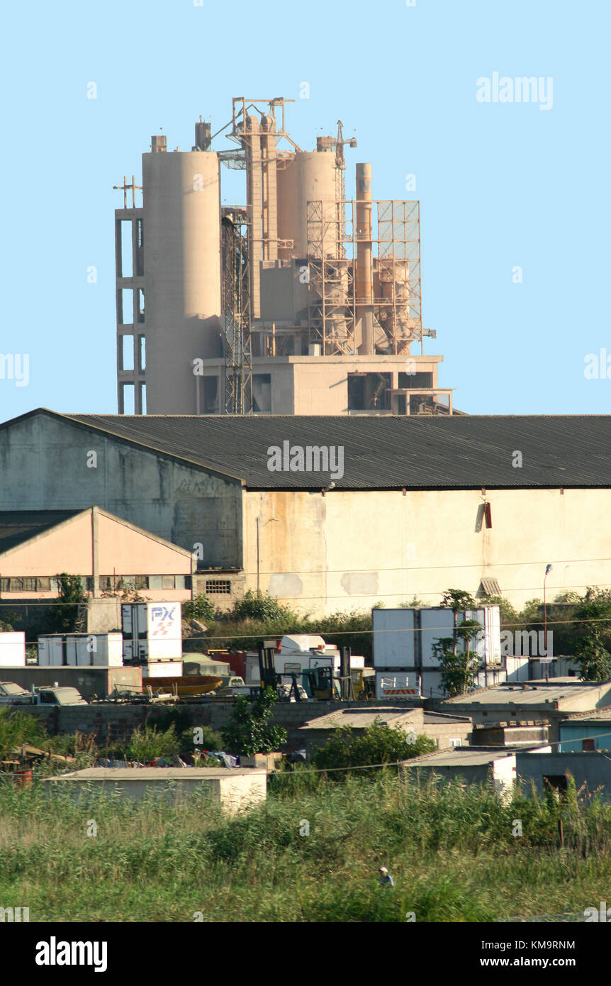 Maputo, Mozambique, grain silo, warehouse and shacks in the foreground ...