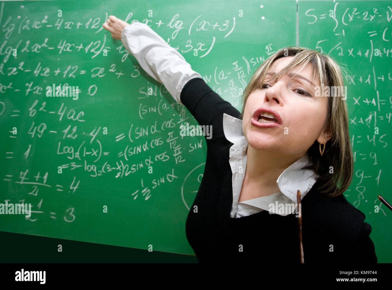 Education - female teacher teaching algebra Stock Photo - Alamy