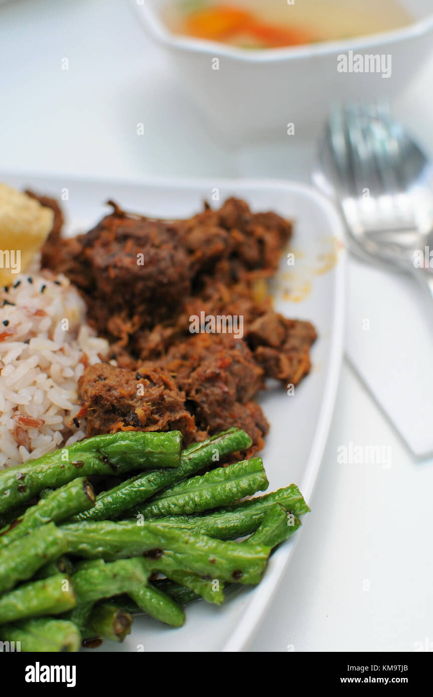 Vegetarian rendang chicken or mutton with unpolished red rice. Suitable ...