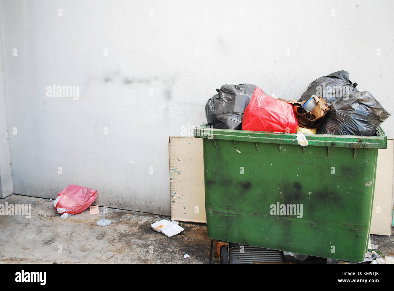 Garbage trolley with overflowing rubbish Stock Photo - Alamy