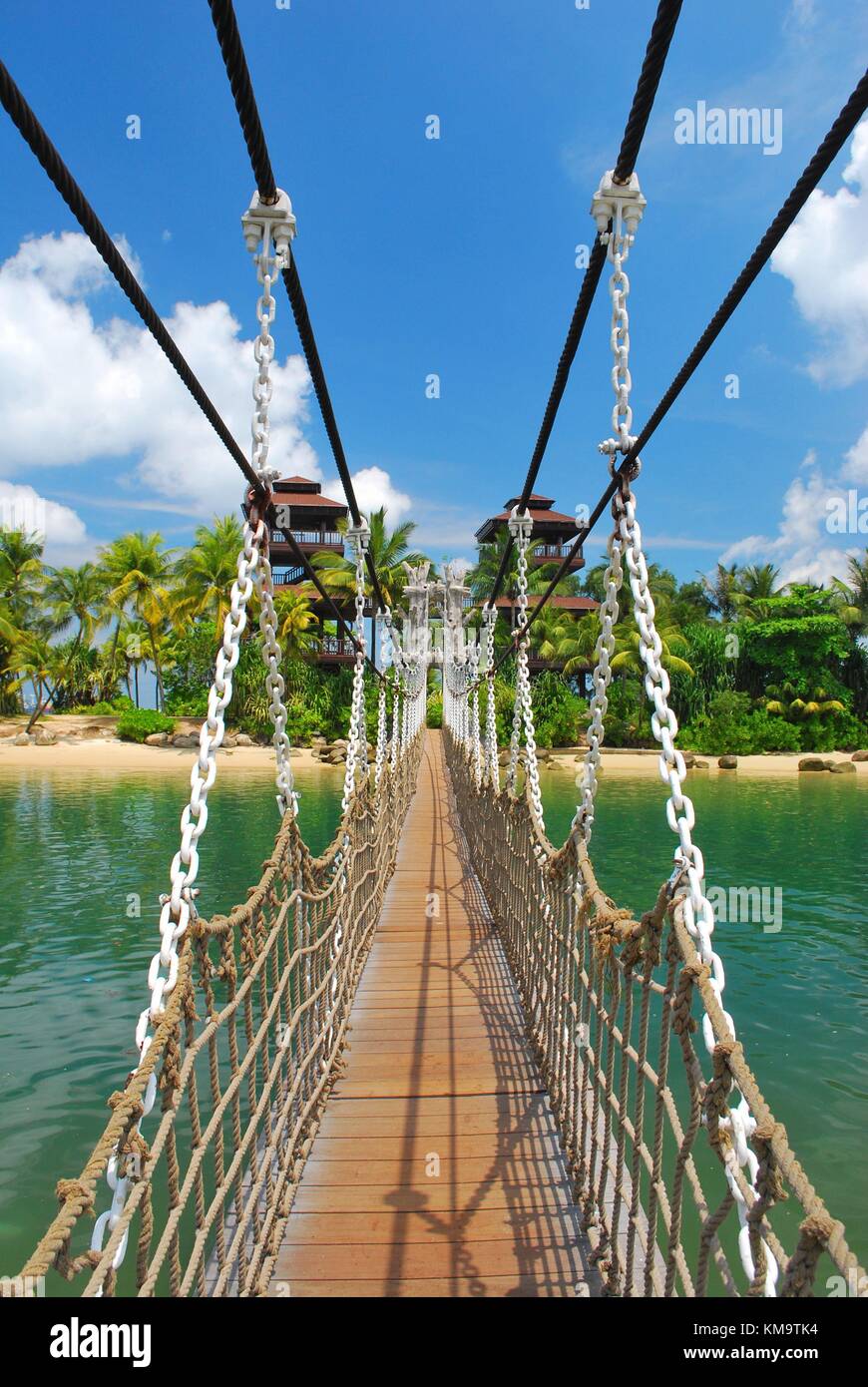 Wooden bridge leading to resort hotels on paradise island Stock Photo ...