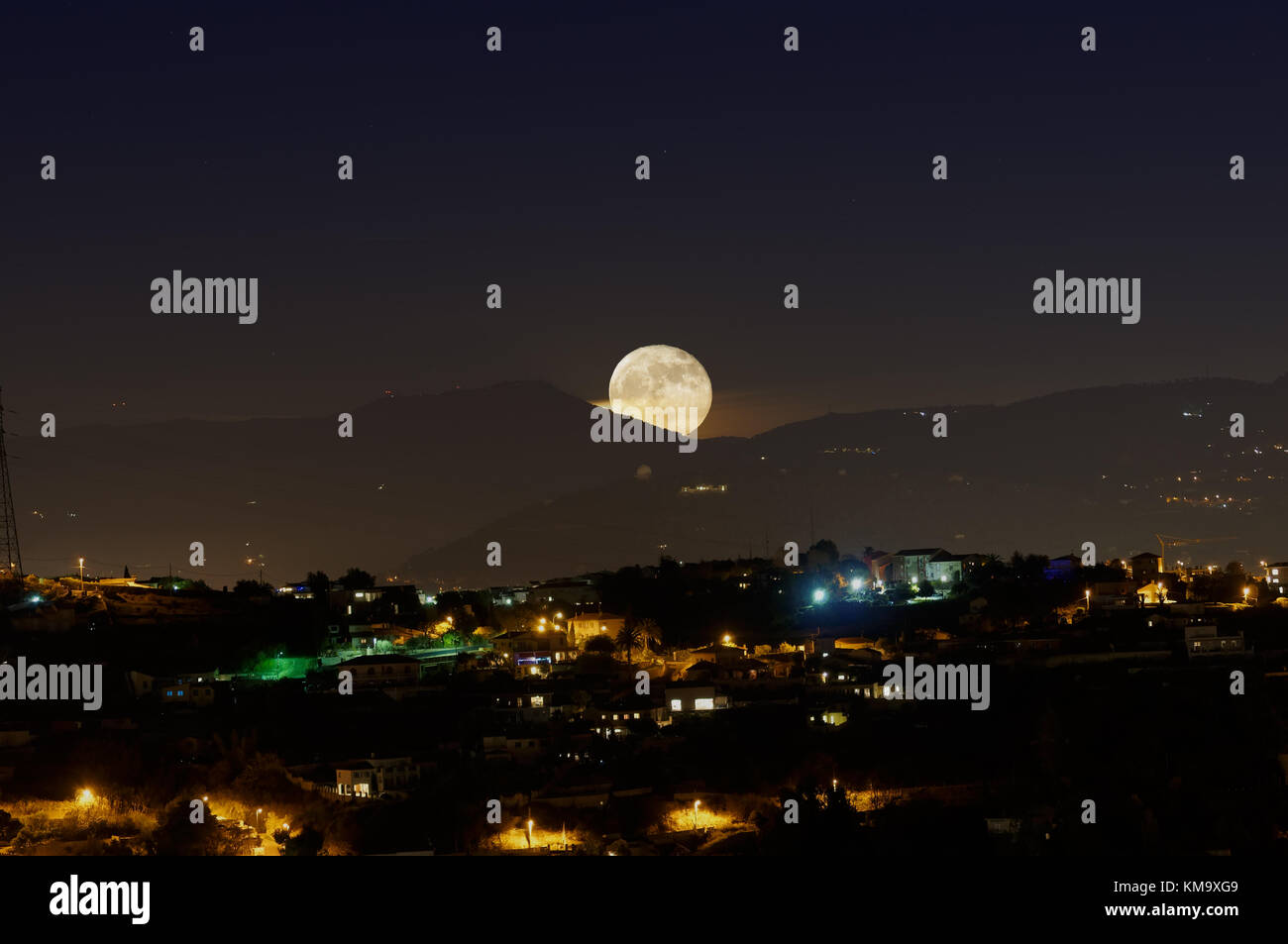 Super moon at moonrise over the mountains in French riviera. moon of ...