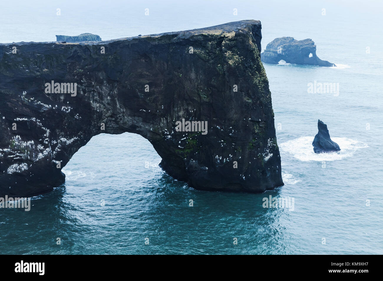 Natural stone arch. Scenic landscape of Dyrholaey Nature Reserve, south ...