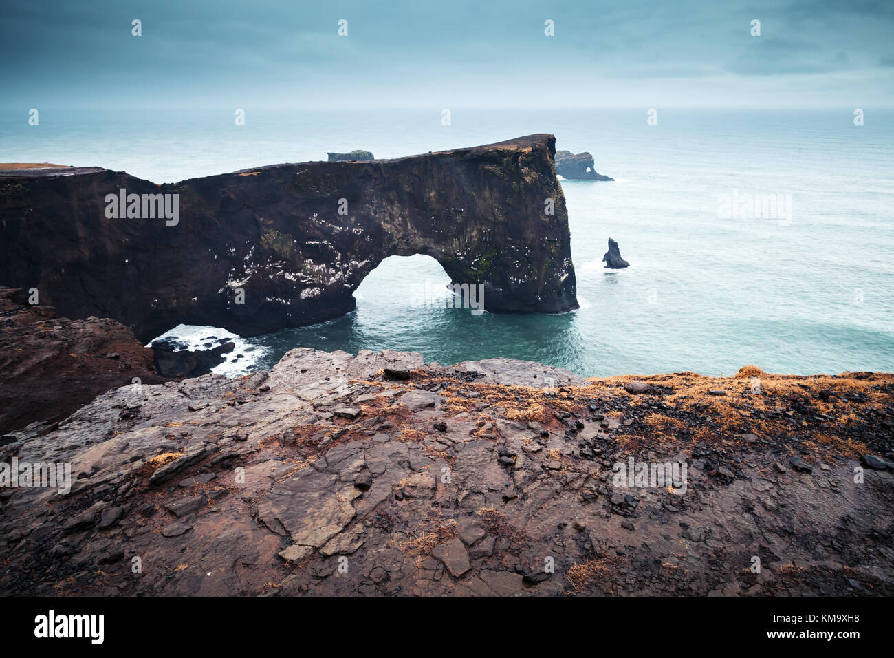 Natural rocky arch. Scenic landscape of Dyrholaey Nature Reserve, south ...