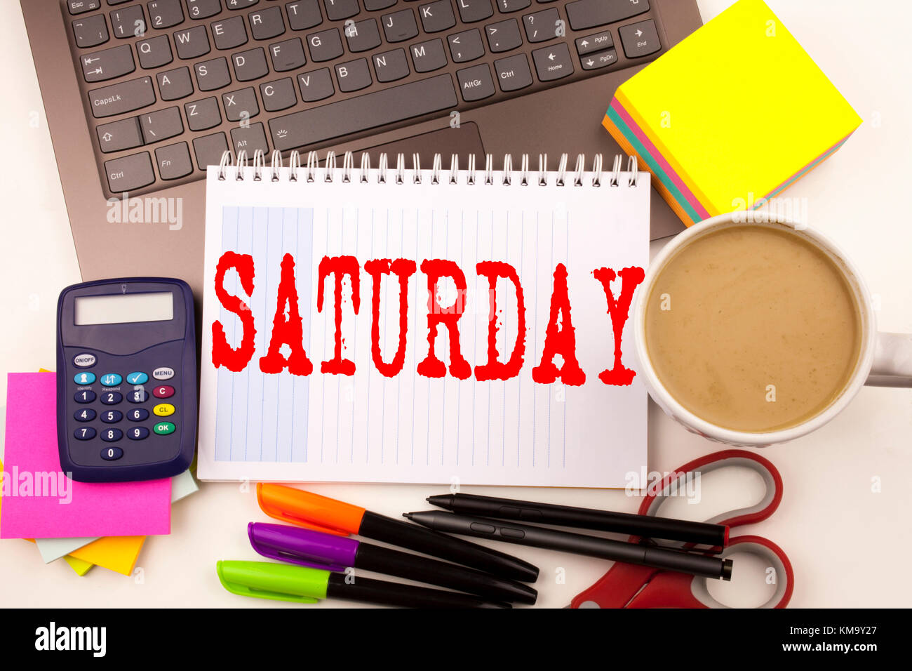 Word writing Saturday in the office with laptop, marker, pen ...