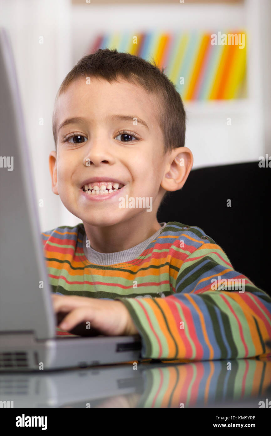 little boy with a laptop play and laugh Stock Photo - Alamy