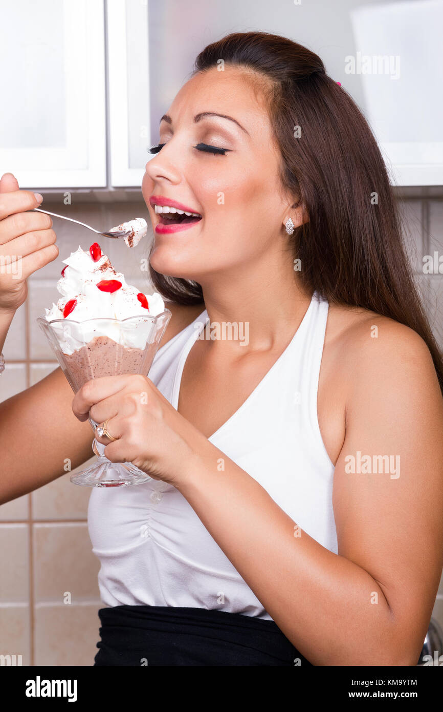 young beautiful woman eating pudding Stock Photo - Alamy