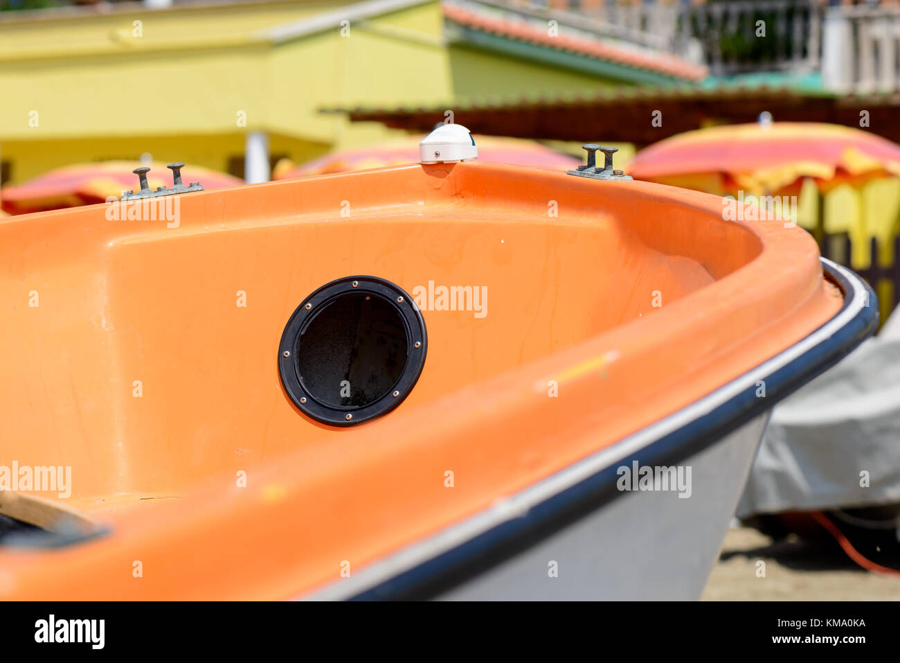 nice orange boat with a black hole Stock Photo - Alamy