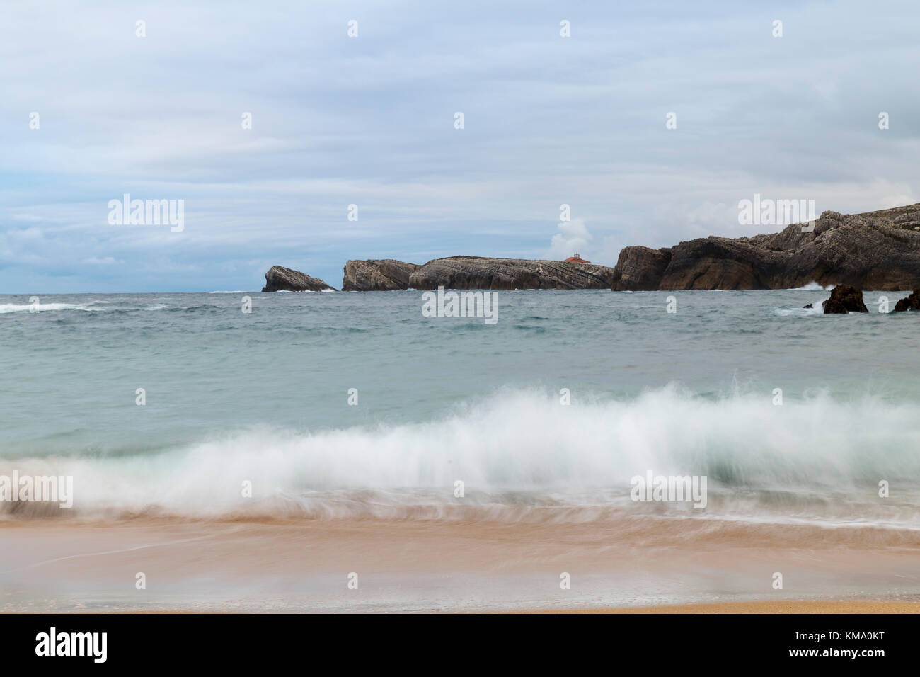 beautiful beach with waves breaking on the shore and without people ...