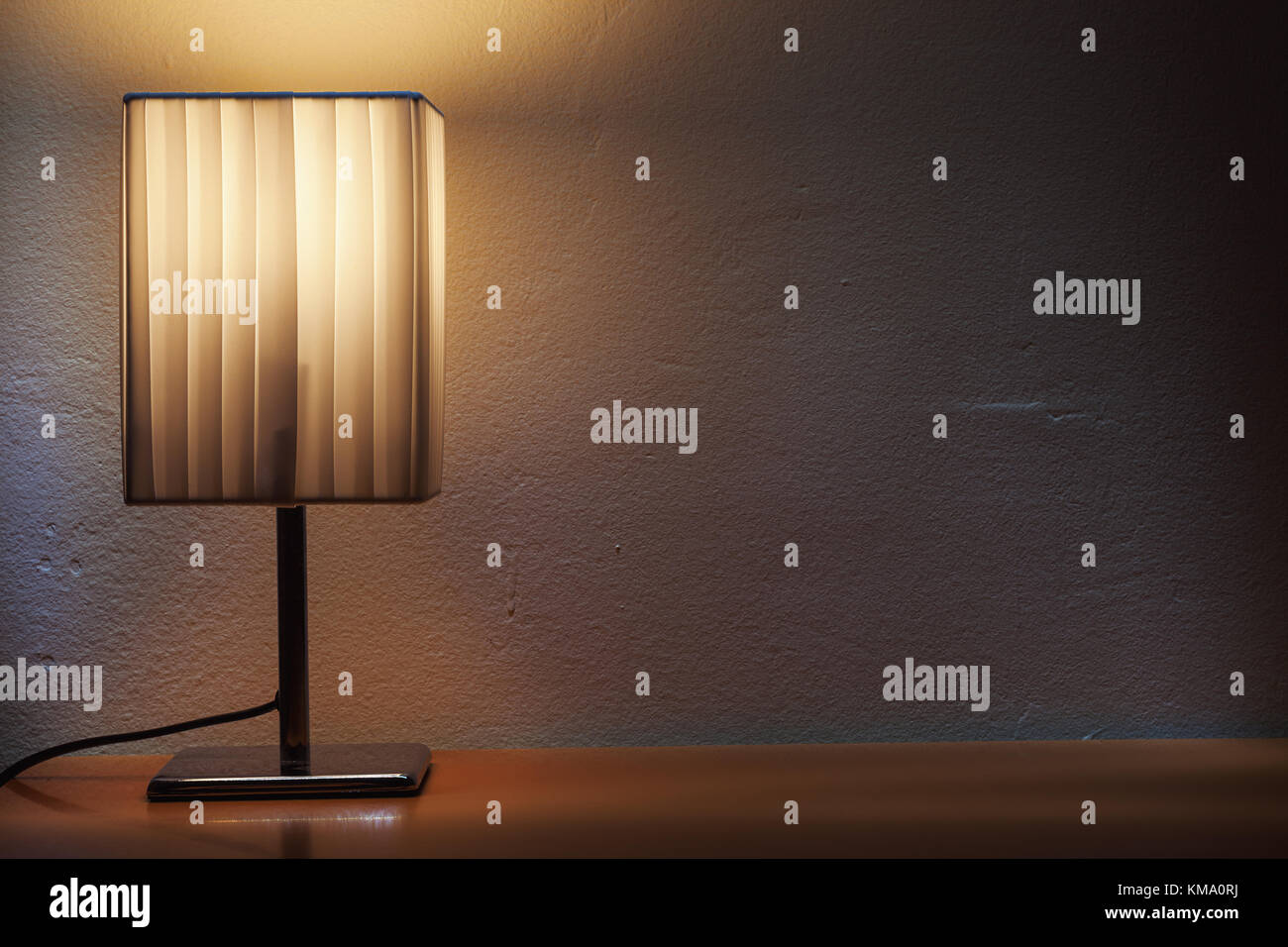 Details of small decorative table lamp in front of a wall Stock Photo ...