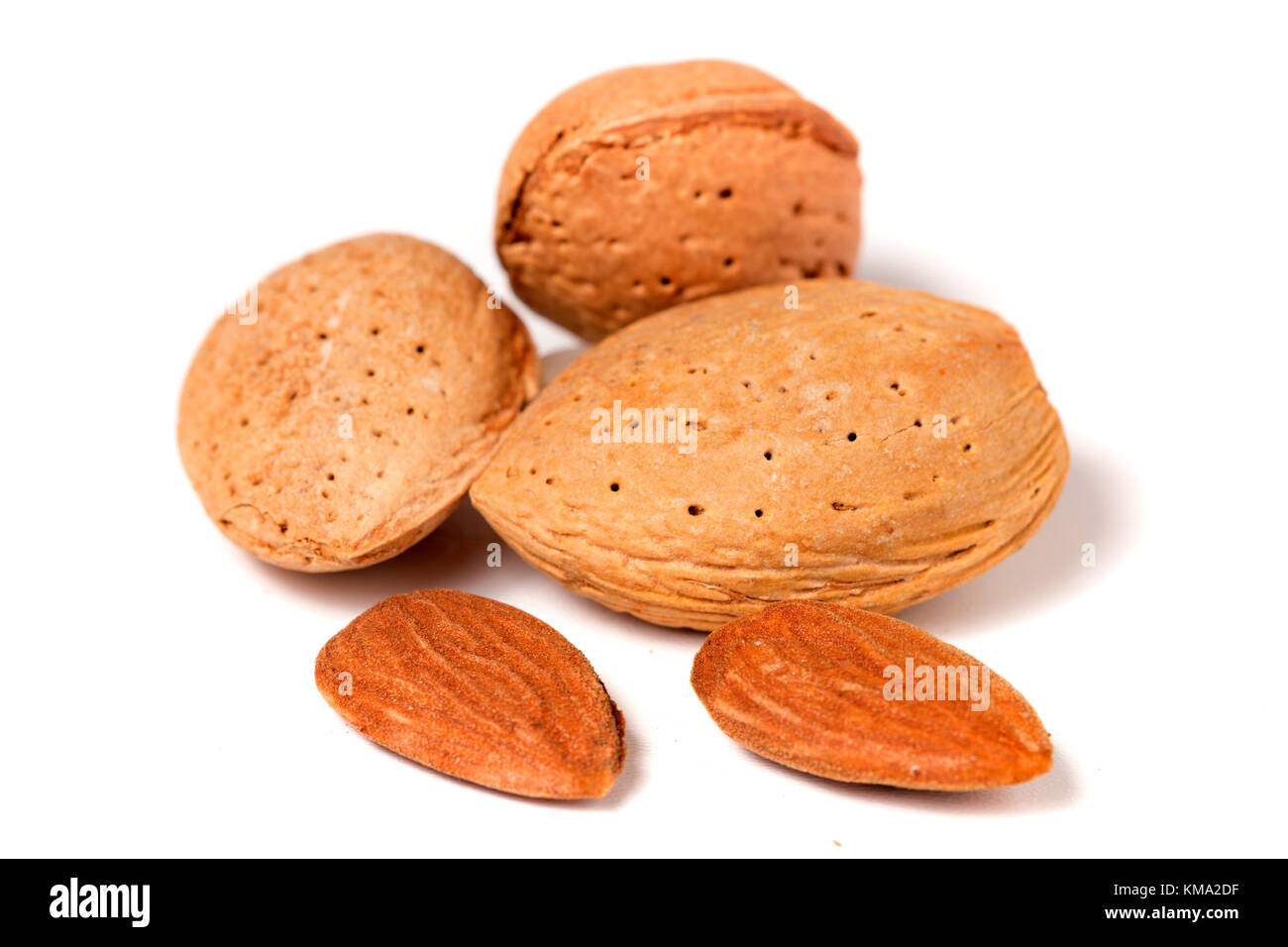 Sweet almonds with seeds isolated on a white background Stock Photo - Alamy