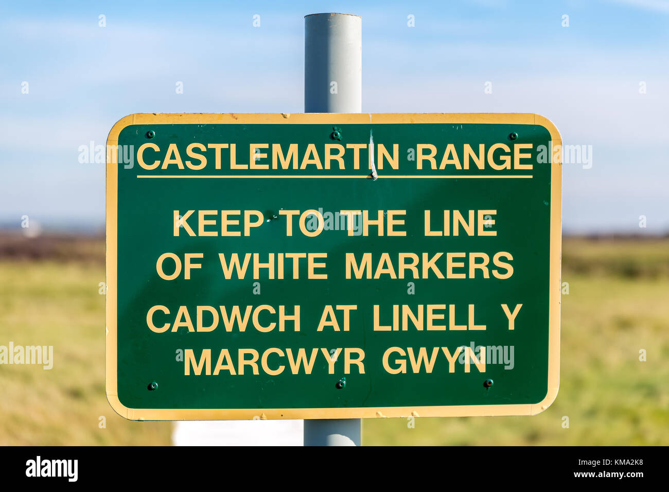 Warning sign: "Keep to the line of white markers" (welsh & english ...