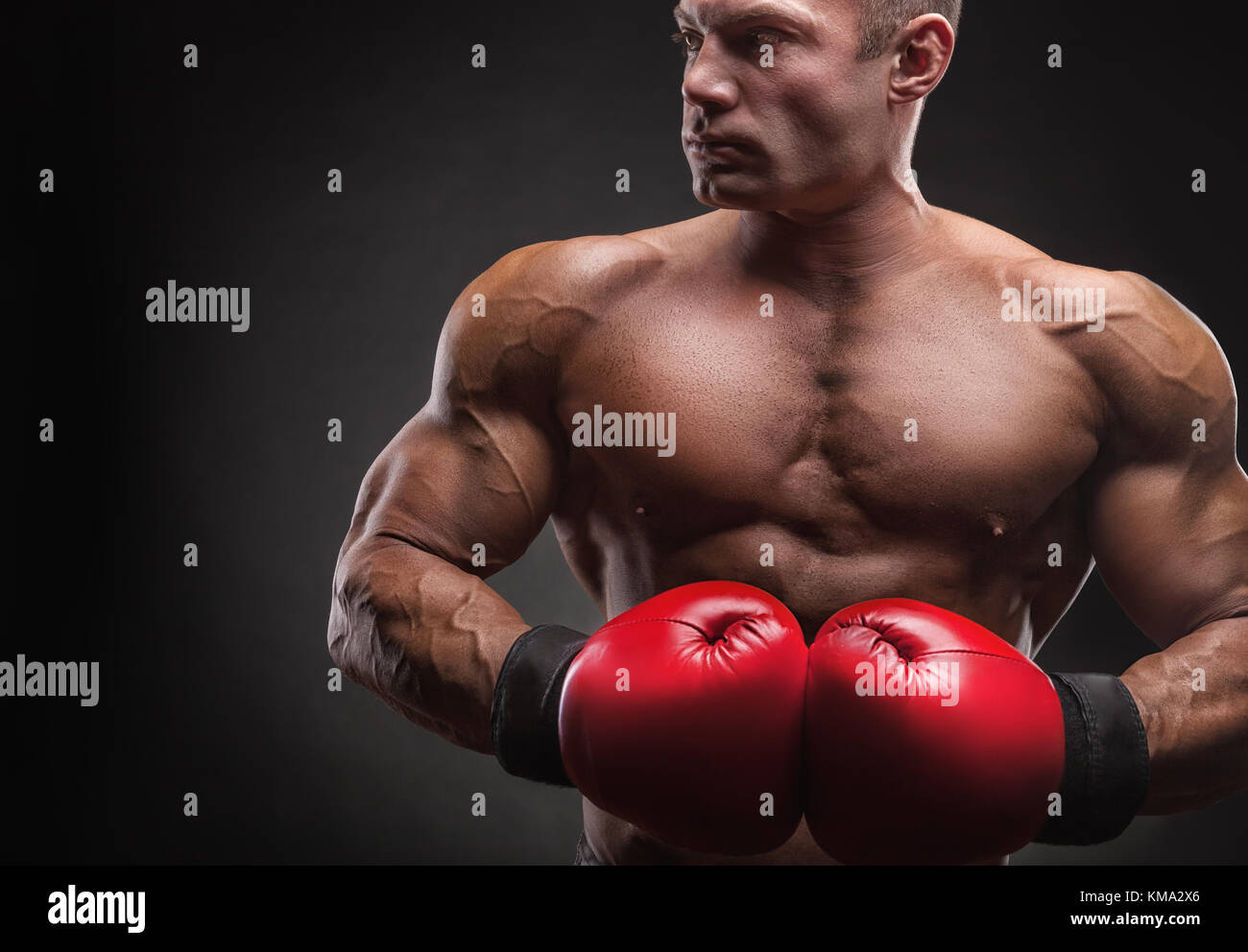 Boxing concept. Handsome boxer in red boxing gloves before a fight ...