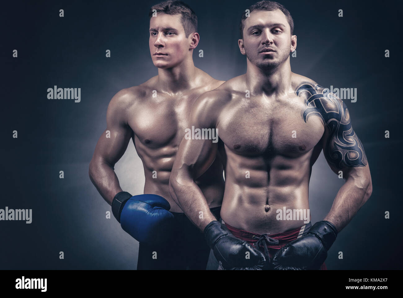 Two handsome boxer with boxing gloves against a black background Stock ...