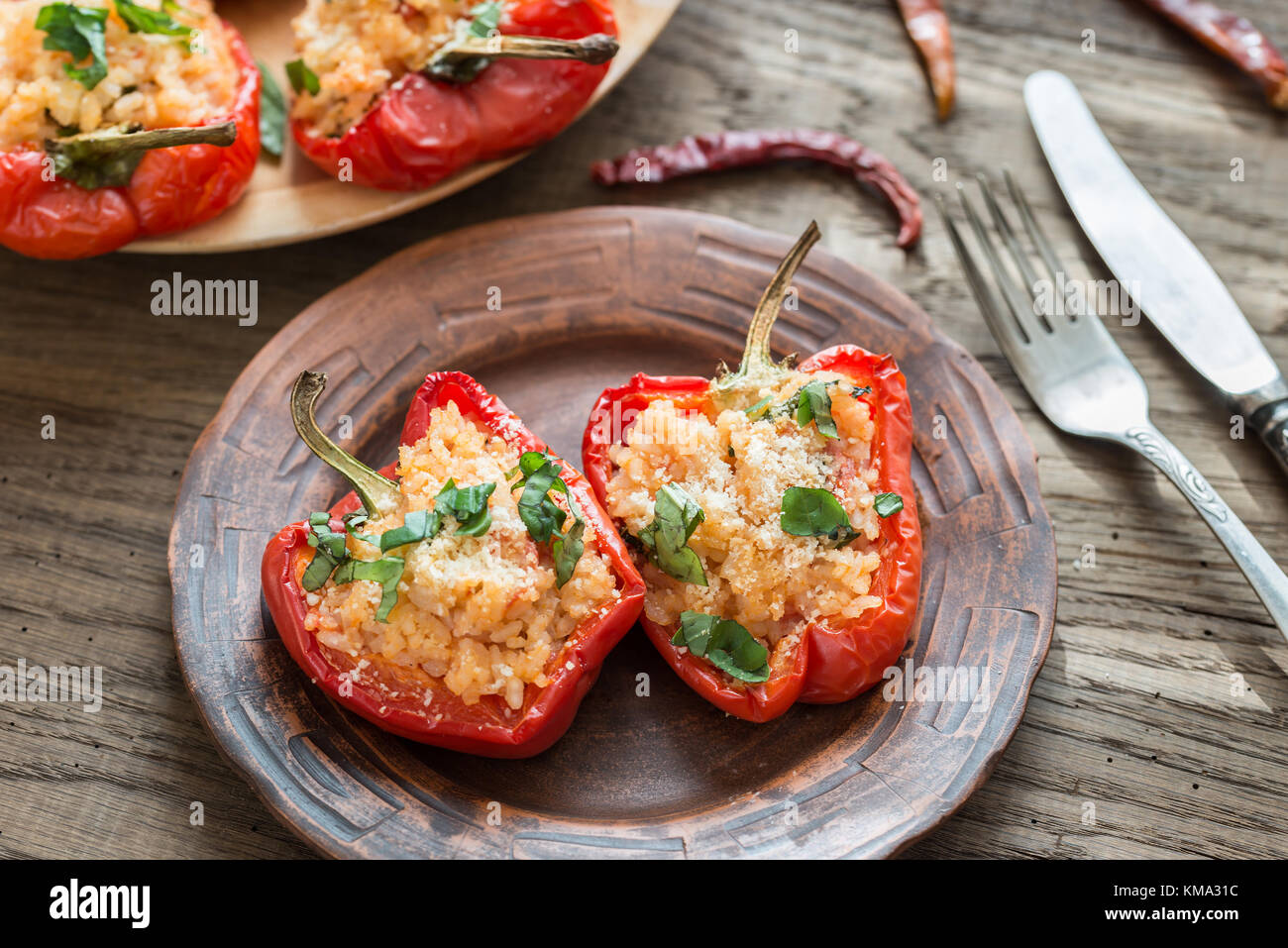 Stuffed red bell peppers with white rice and cheese Stock Photo - Alamy