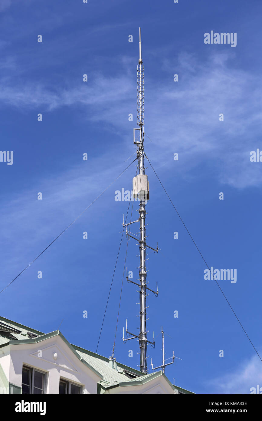 Communication Antenna at Top of Building in City Stock Photo - Alamy