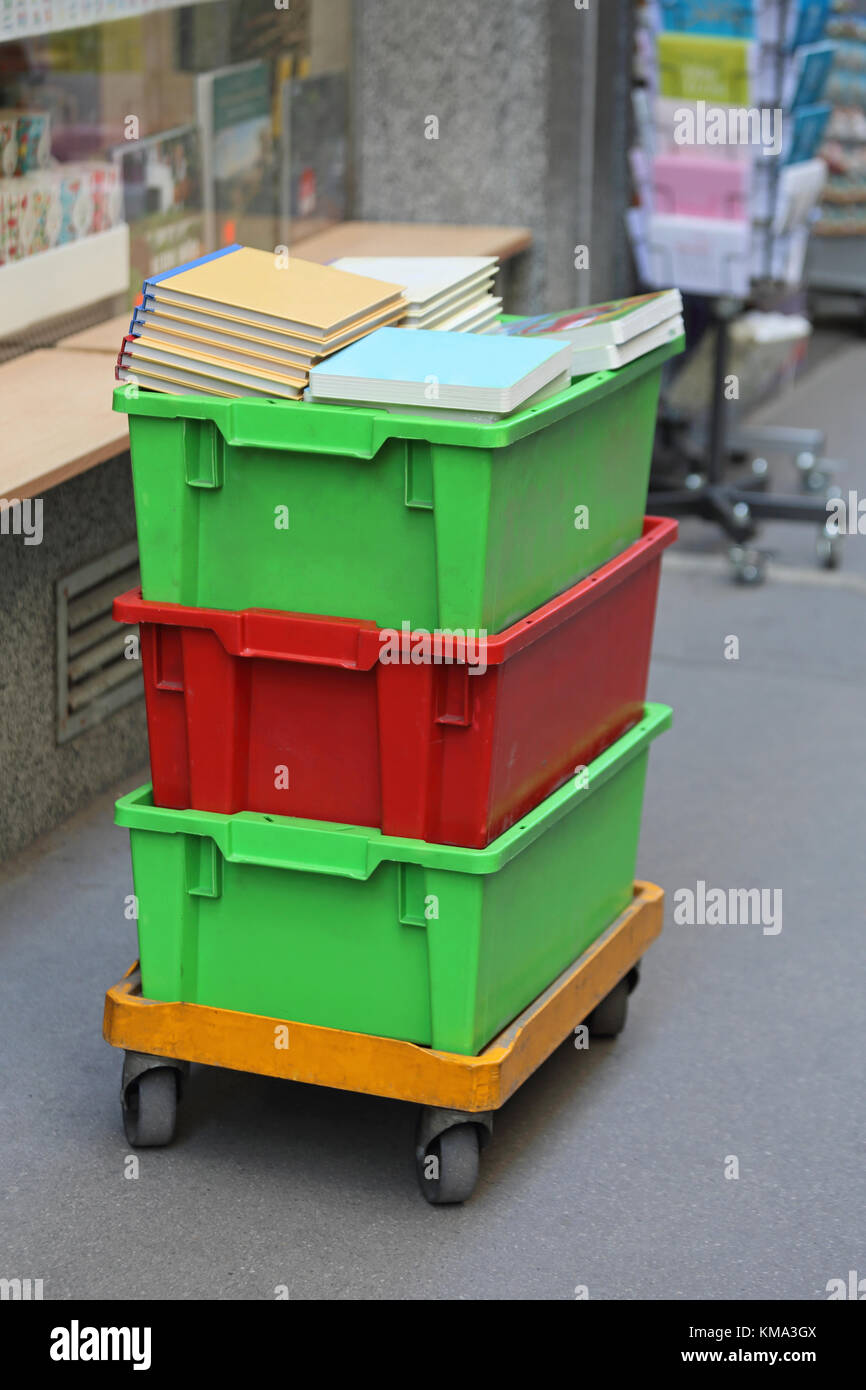 Books Delivery in Plastic Crates With Cart at Street Stock Photo - Alamy