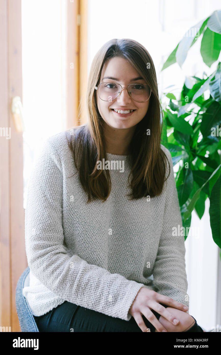 Attractive woman wearing glasses sitting hi-res stock photography and ...