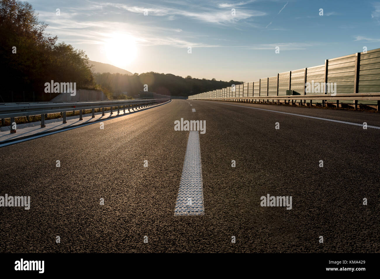 Empty Highway road with markings at sunset Stock Photo - Alamy