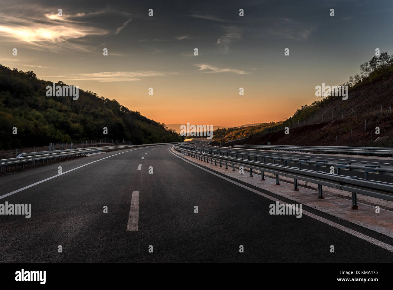 Empty Highway road with markings at sunset Stock Photo - Alamy