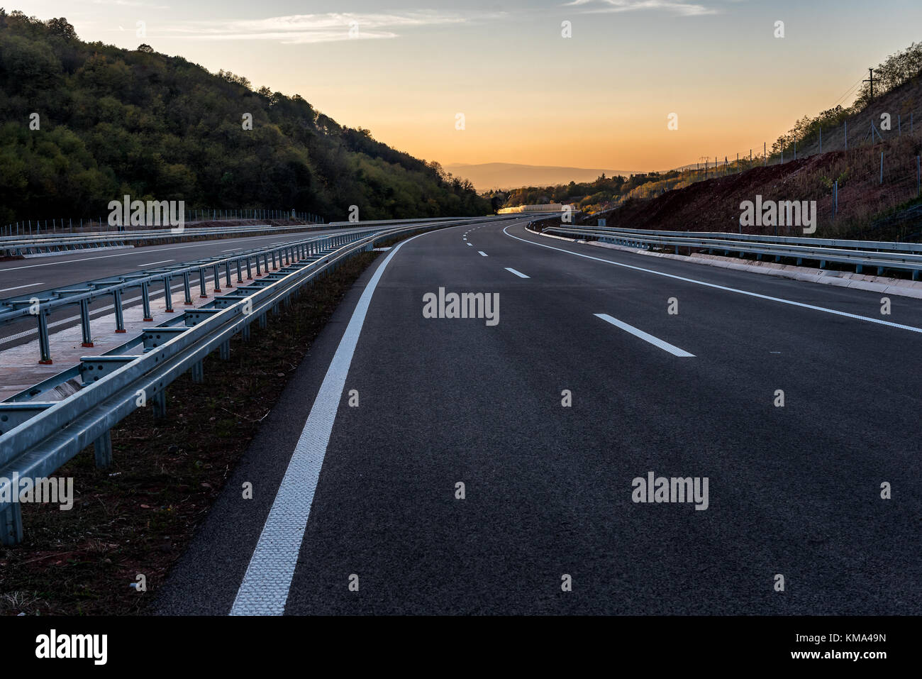 Empty Highway road with markings at sunset Stock Photo - Alamy