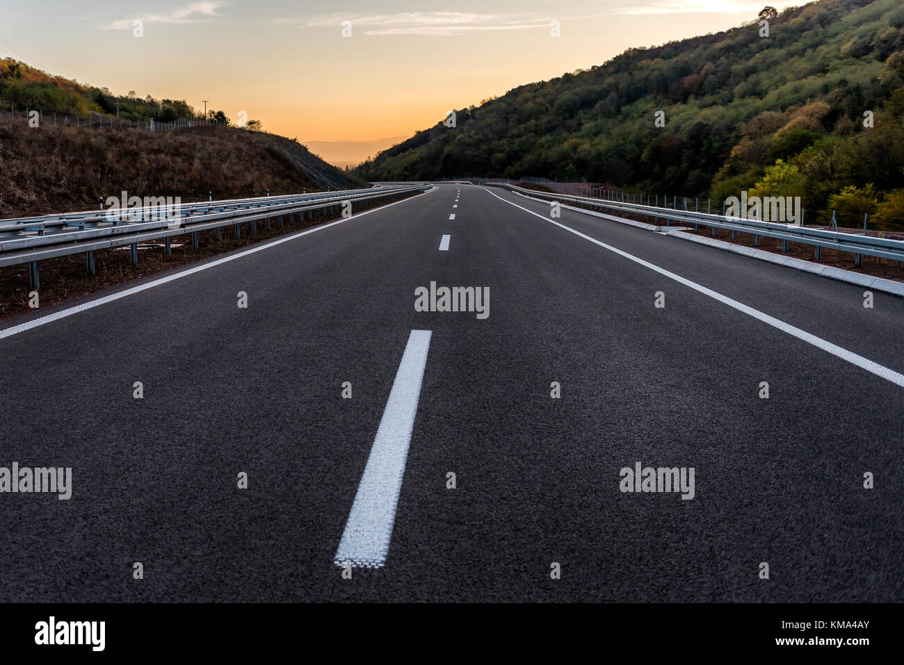 Empty Highway road with markings at sunset Stock Photo - Alamy