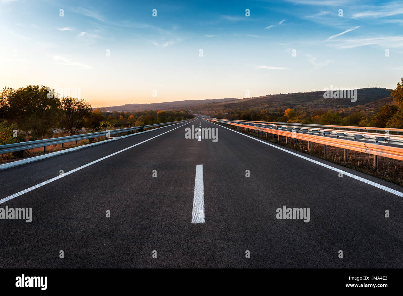 Empty Highway road with markings at sunset Stock Photo - Alamy