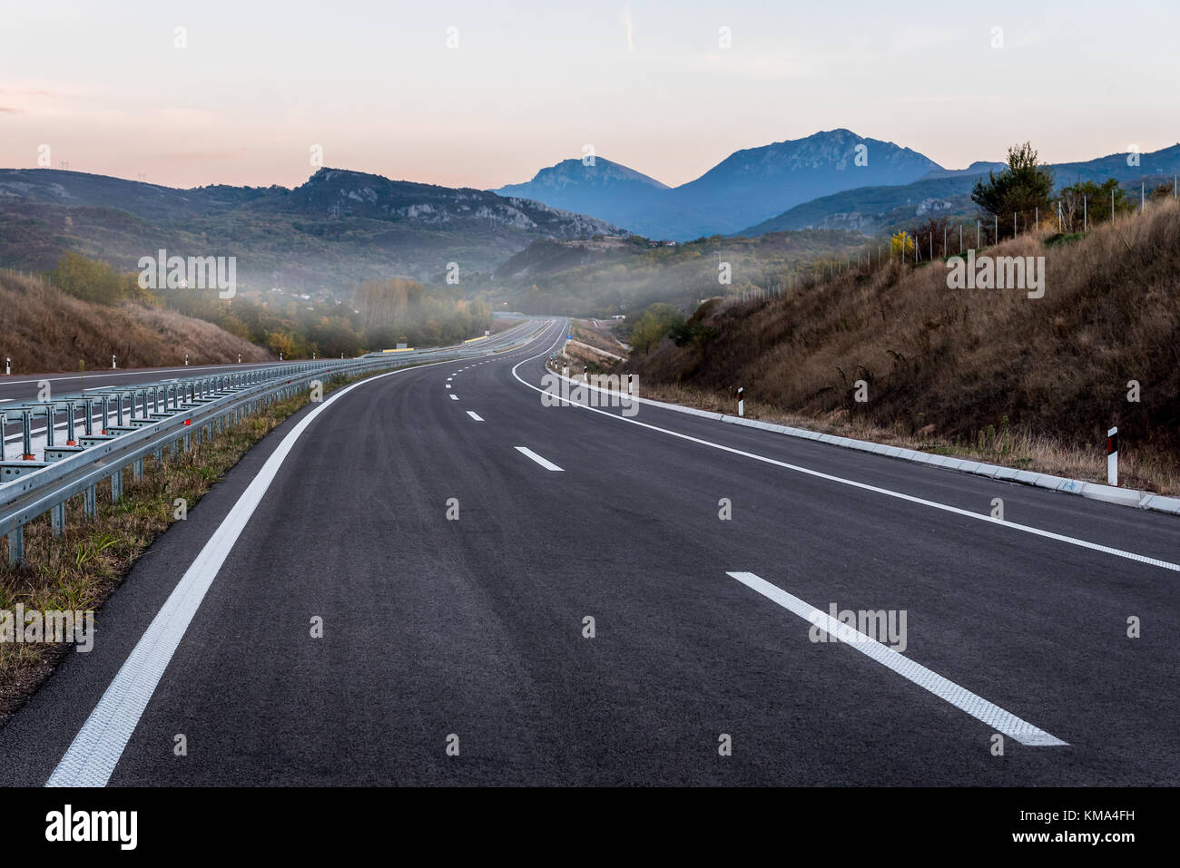 Empty Highway road with markings at sunset Stock Photo - Alamy