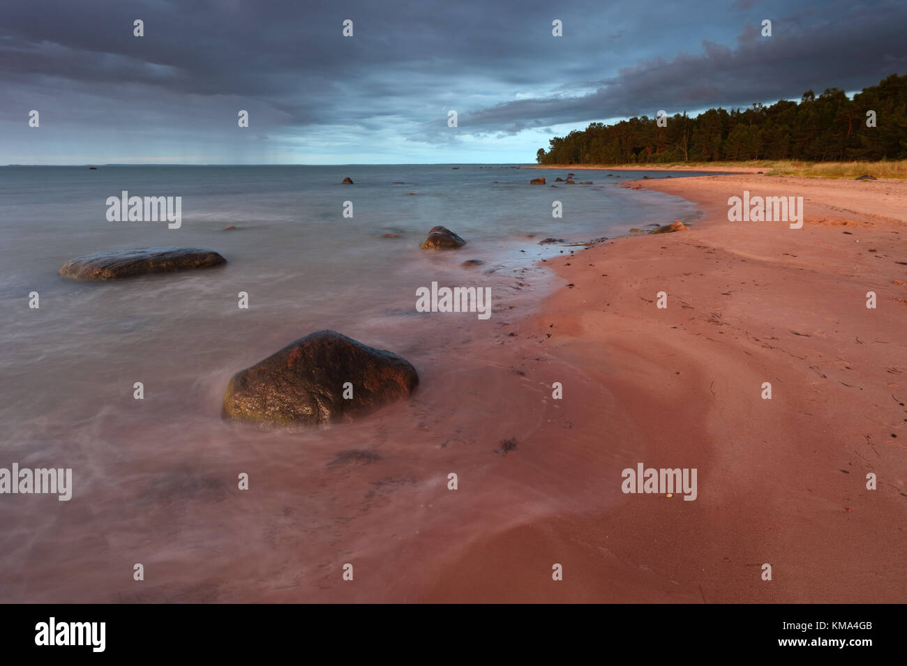 Sunset through the rain, Baltic sea coast at Kõpu peninsula, Hiiumaa ...