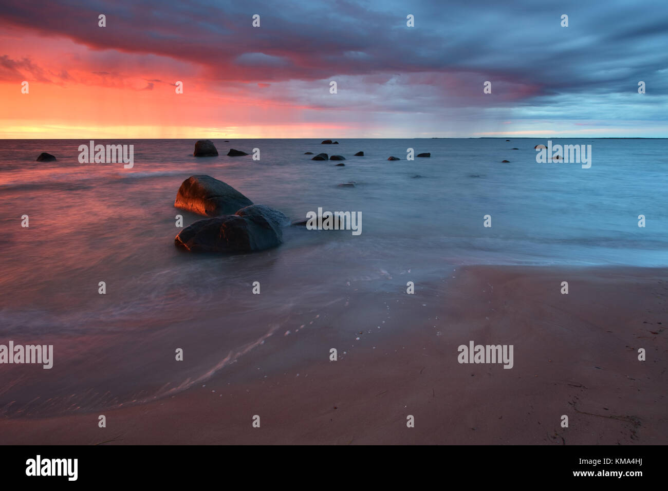 Sunset through the rain, Baltic sea coast at Kõpu peninsula, Hiiumaa ...