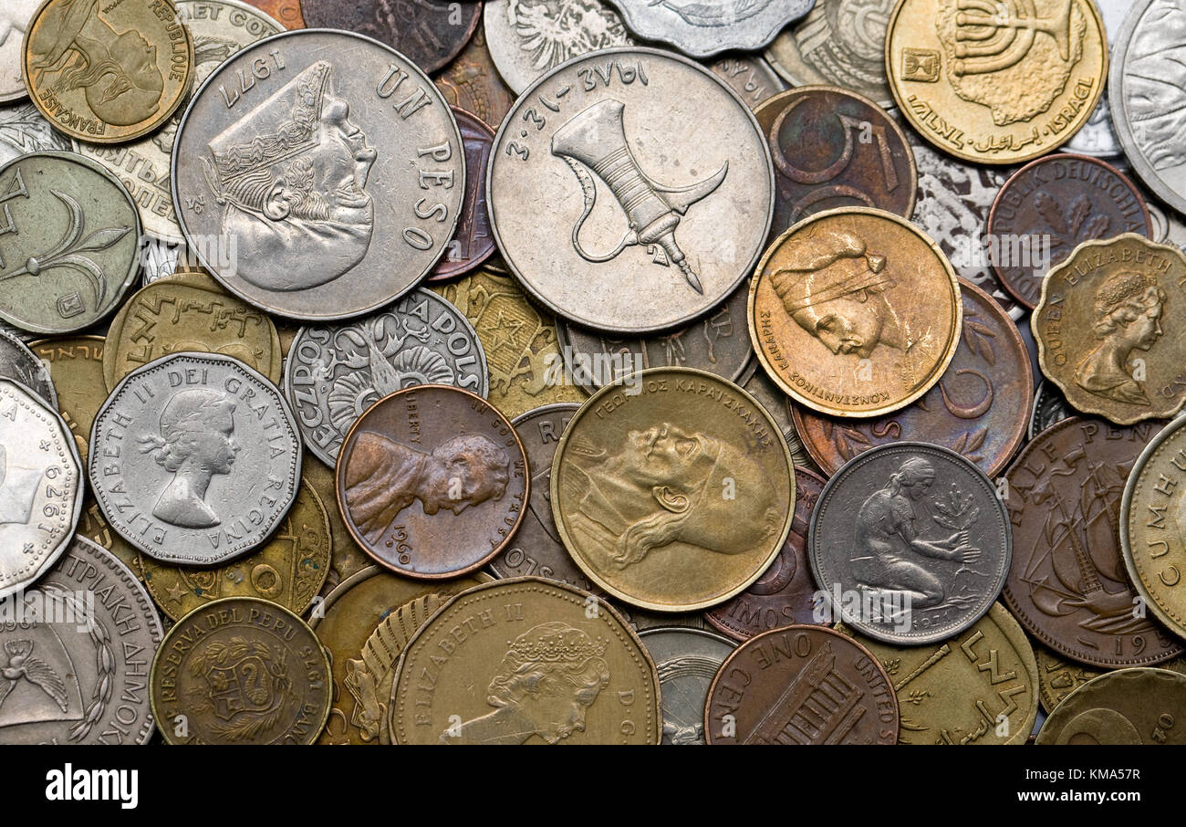 background of the coins of different countries Stock Photo - Alamy