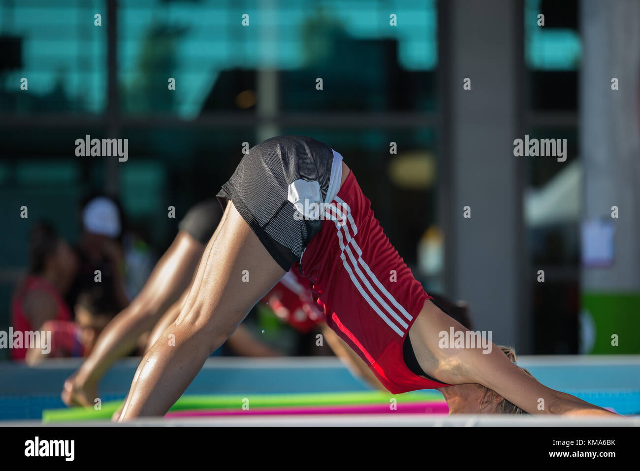 Girls Doing Exercises on Floating Fitness Mat in an Outdoor Swimming ...